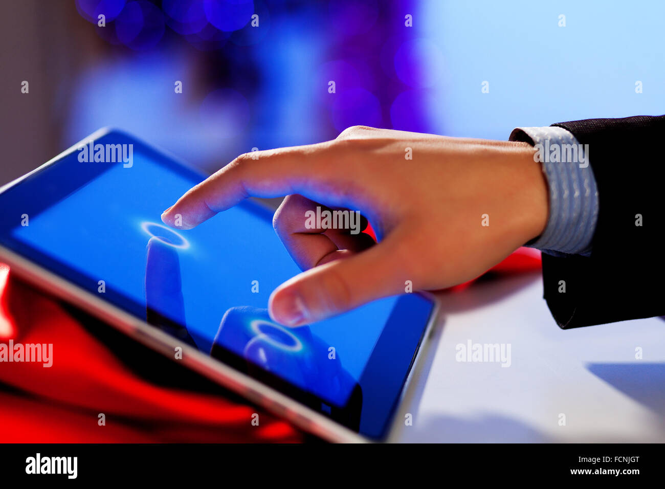 Close-up image of finger touching blue screen Stock Photo - Alamy