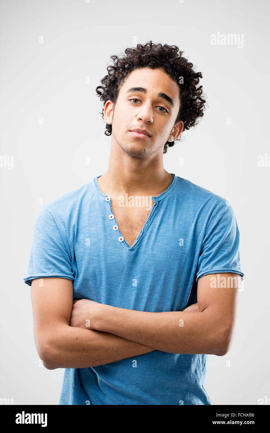 handsome irritated young man with blue shirt showing off he's bored or ...