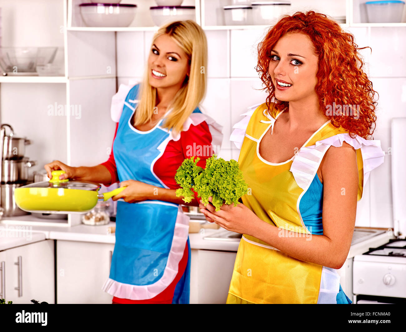 Group women preparing food at kitchen Stock Photo - Alamy