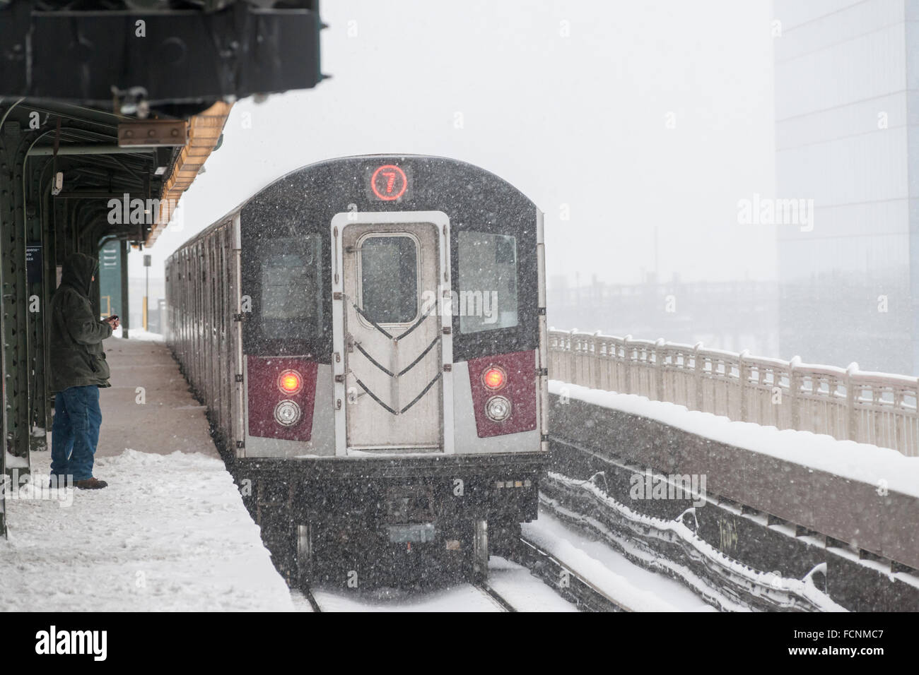 New York, USA. 23rd Jan, 2016. An elevated Flushing Line train departs ...