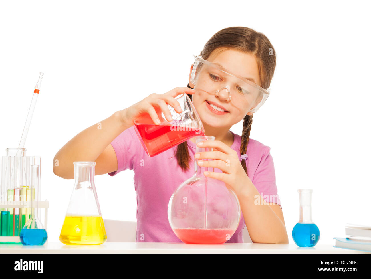 Pouring liquid from volumetric glass to big flask Stock Photo - Alamy