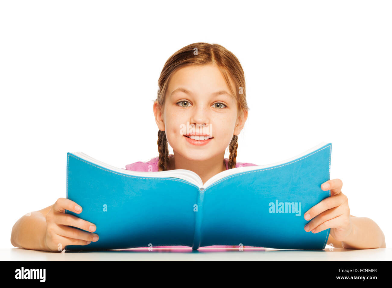 Schoolgirl holding textbook in her hands Stock Photo - Alamy