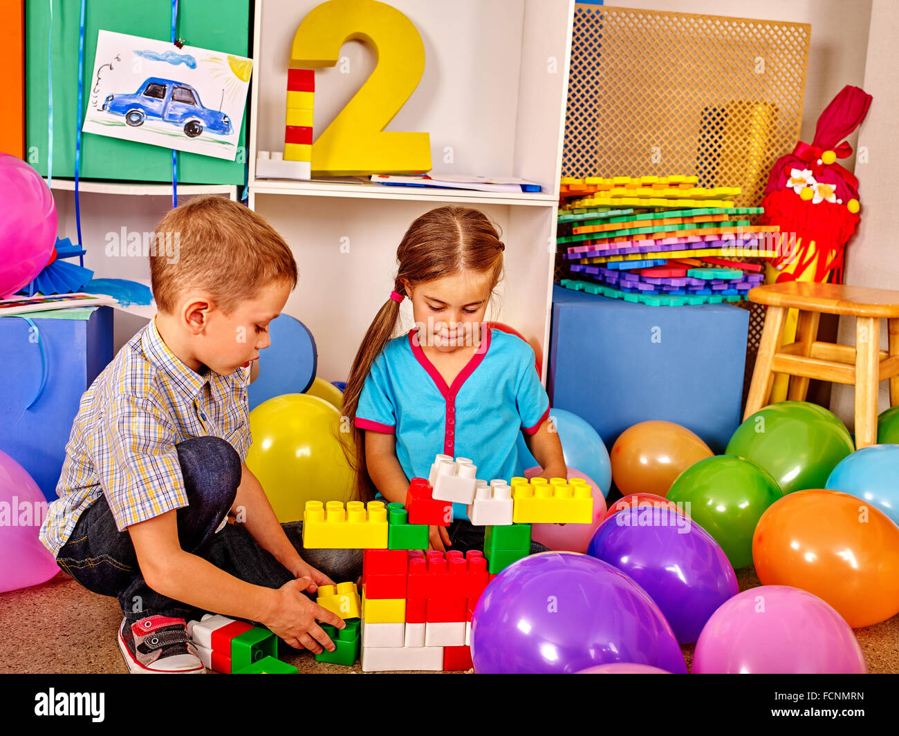 Group children game blocks on floor Stock Photo - Alamy