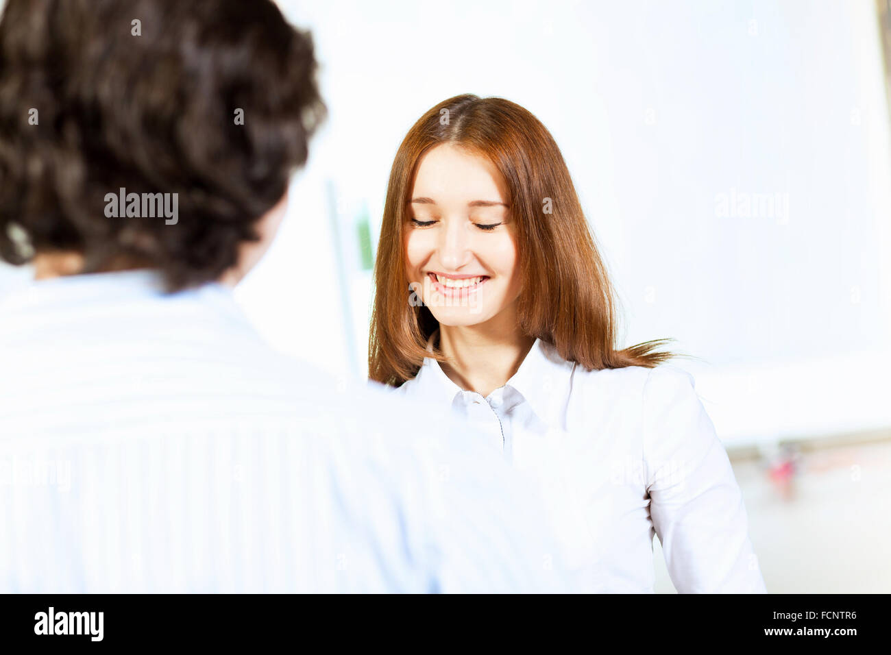 Image of two students discussing their work Stock Photo - Alamy