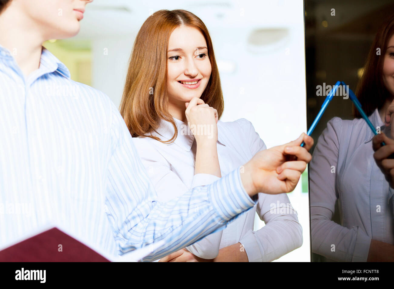 Image of two students discussing their work Stock Photo - Alamy