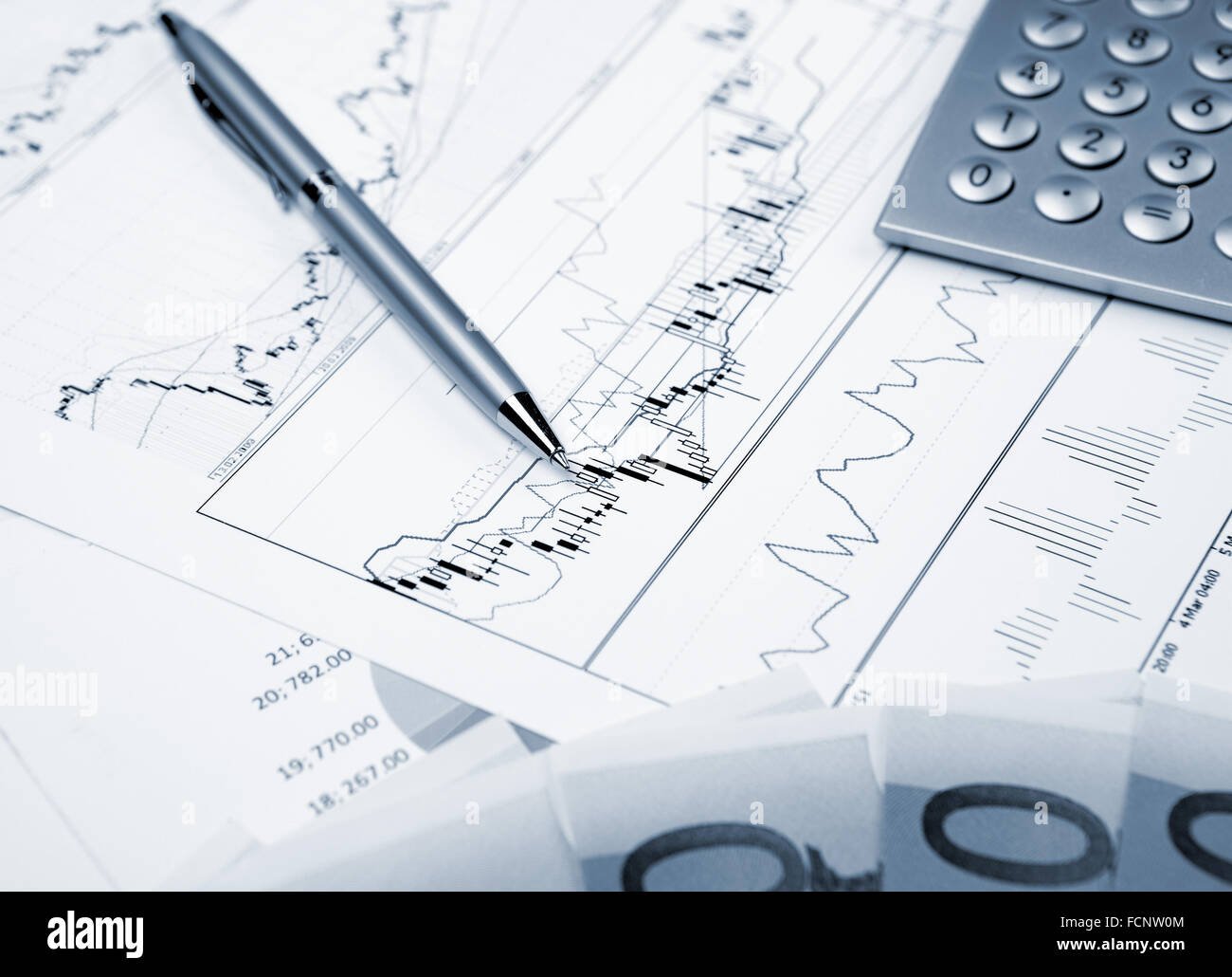 financial charts and graphs on the table Stock Photo - Alamy