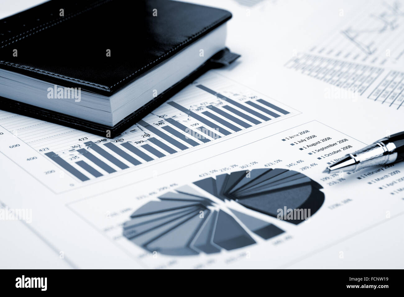 financial charts and graphs on the table Stock Photo - Alamy