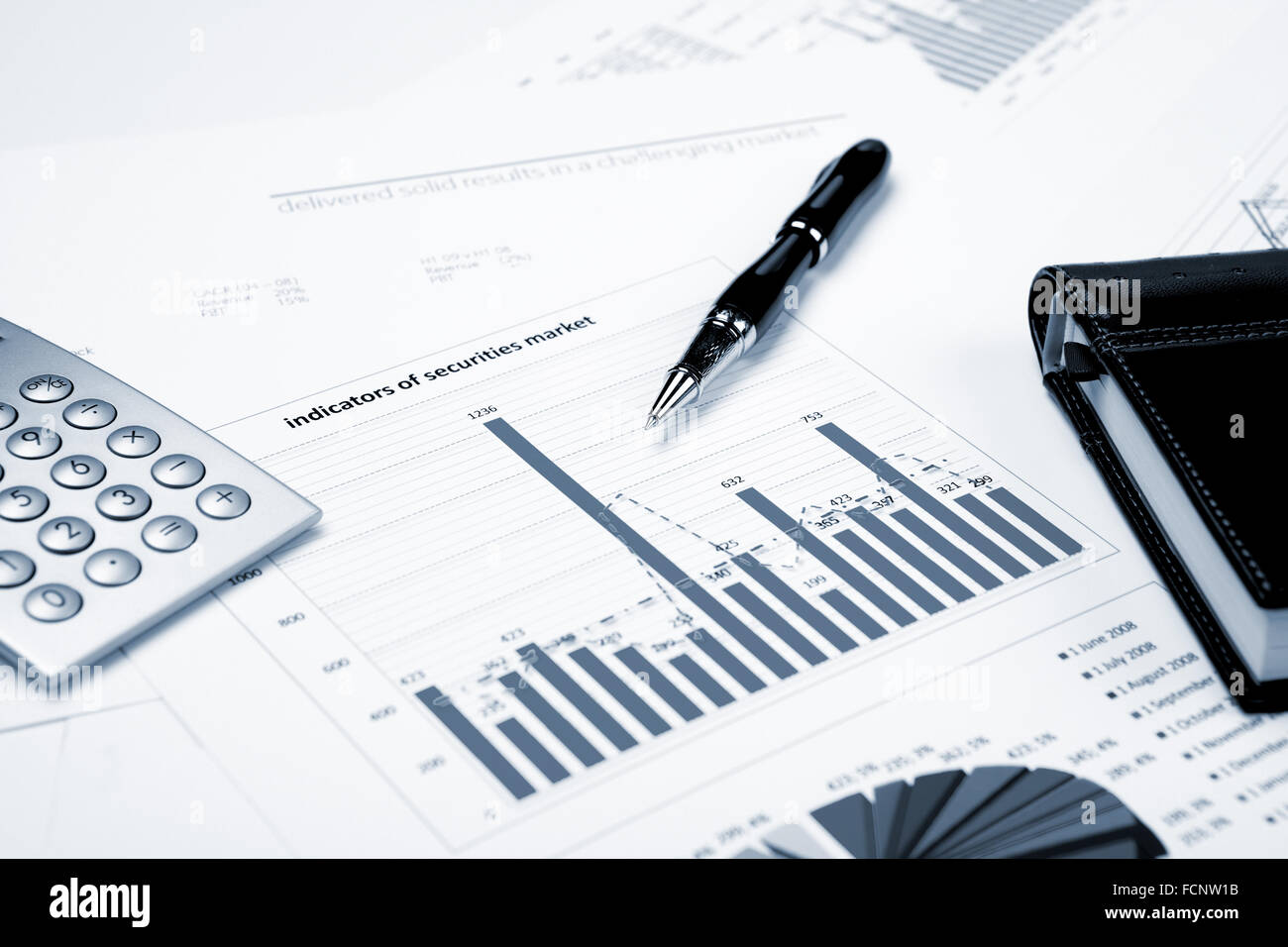 financial charts and graphs on the table Stock Photo - Alamy
