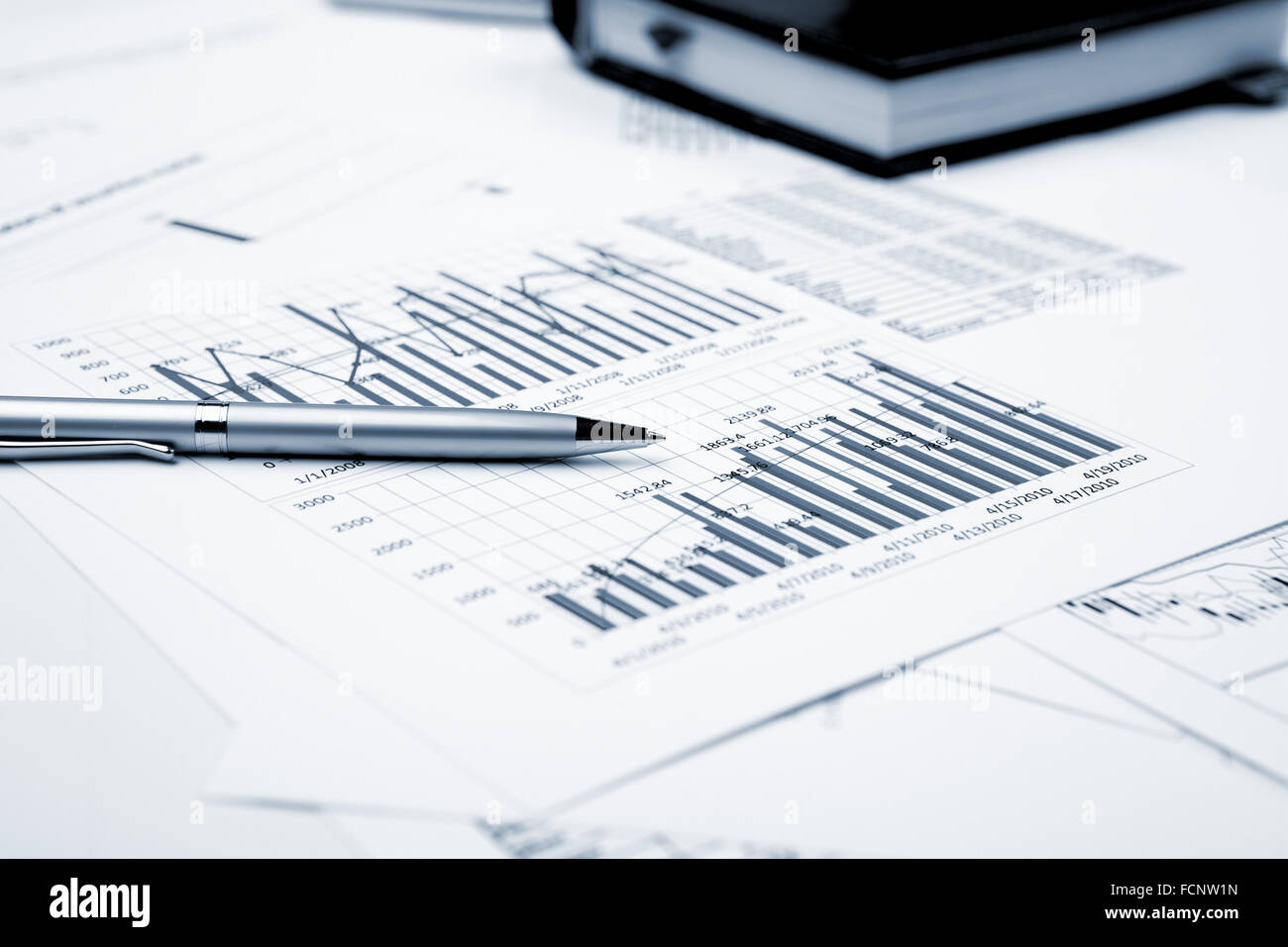 financial charts and graphs on the table Stock Photo - Alamy