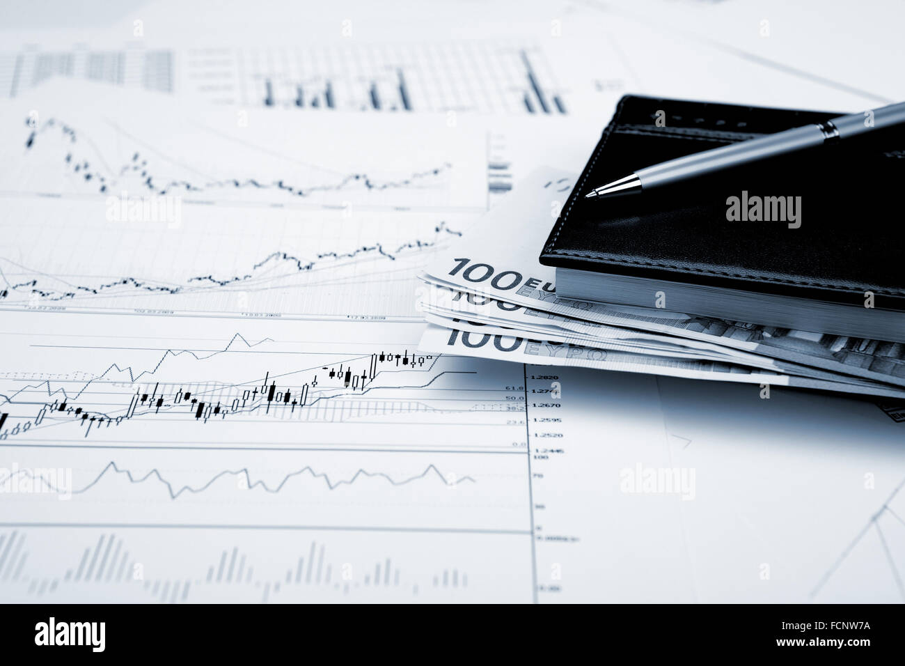 financial charts and graphs on the table Stock Photo - Alamy