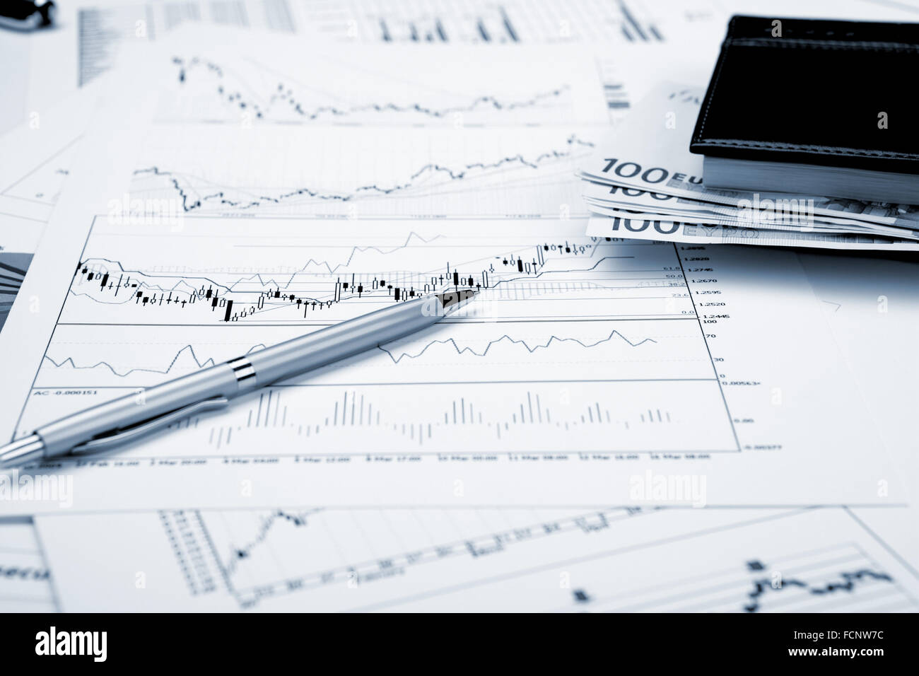financial charts and graphs on the table Stock Photo - Alamy