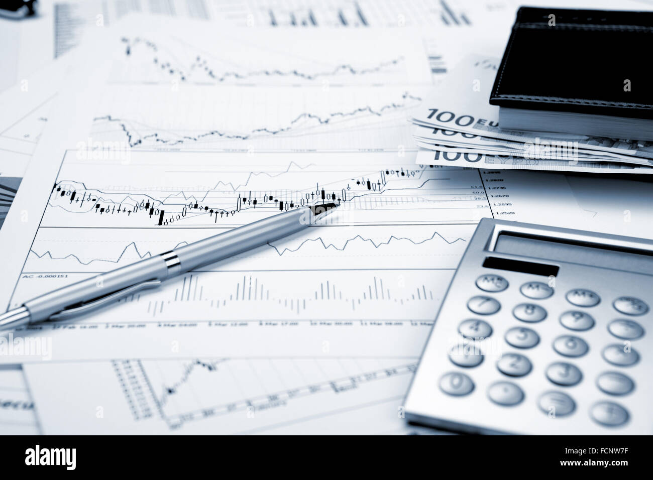 financial charts and graphs on the table Stock Photo - Alamy