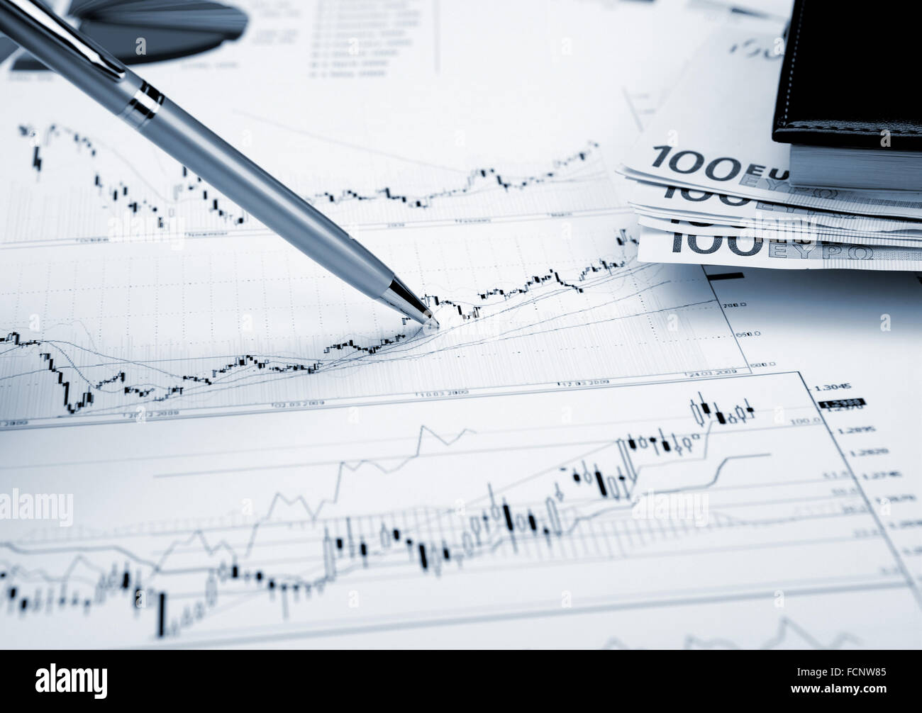 financial charts and graphs on the table Stock Photo - Alamy