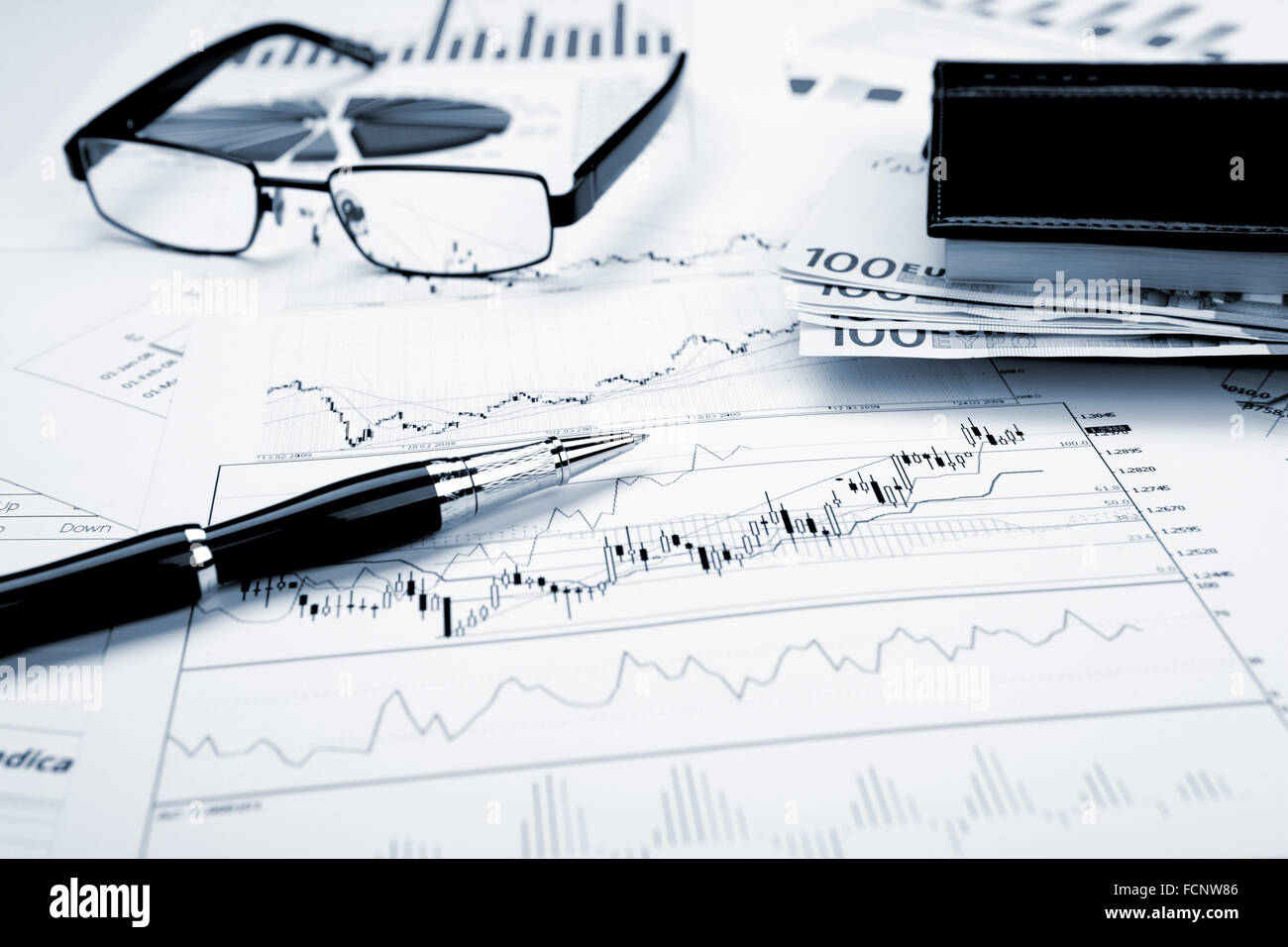financial charts and graphs on the table Stock Photo - Alamy