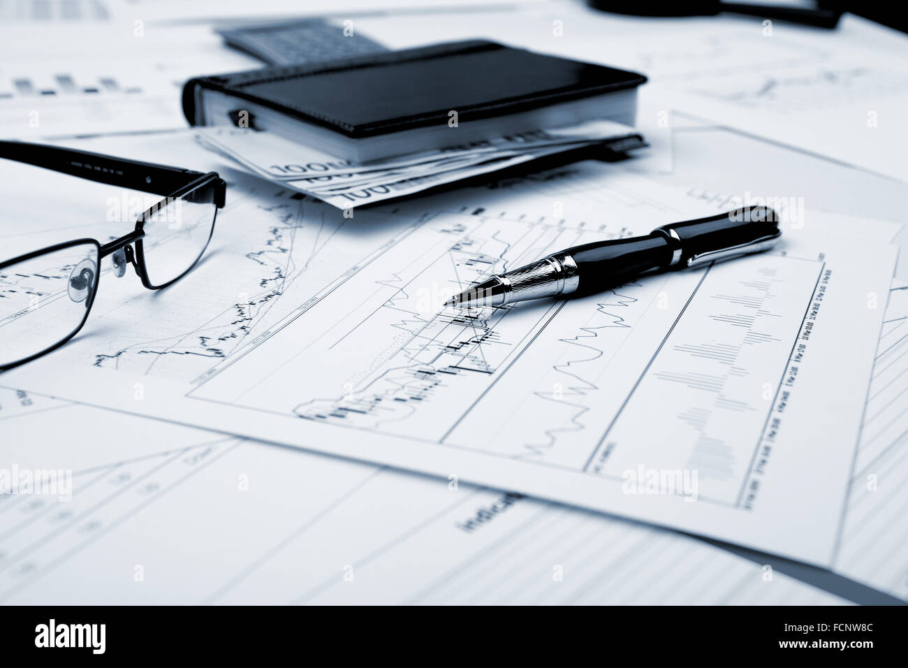 financial charts and graphs on the table Stock Photo - Alamy