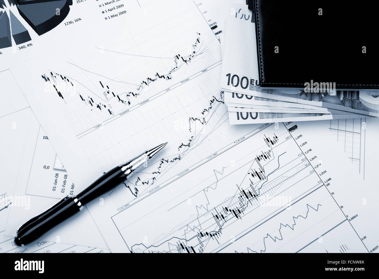 financial charts and graphs on the table Stock Photo - Alamy