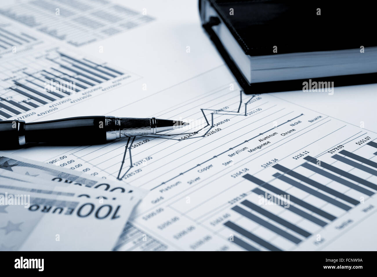 financial charts and graphs on the table Stock Photo - Alamy