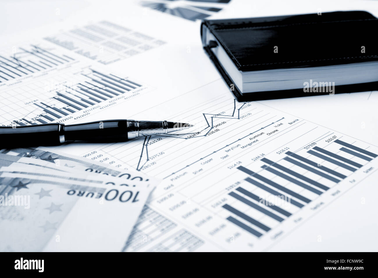 financial charts and graphs on the table Stock Photo - Alamy