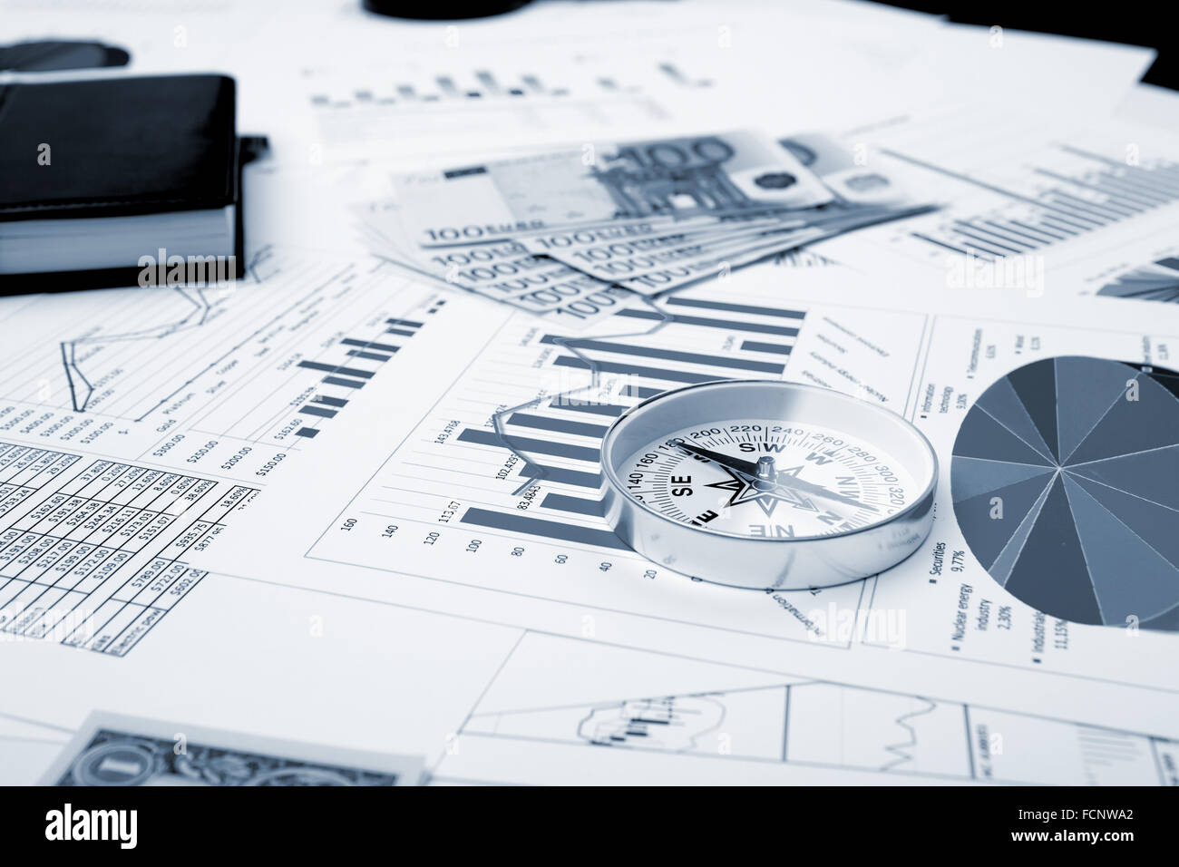 financial charts and graphs on the table Stock Photo - Alamy
