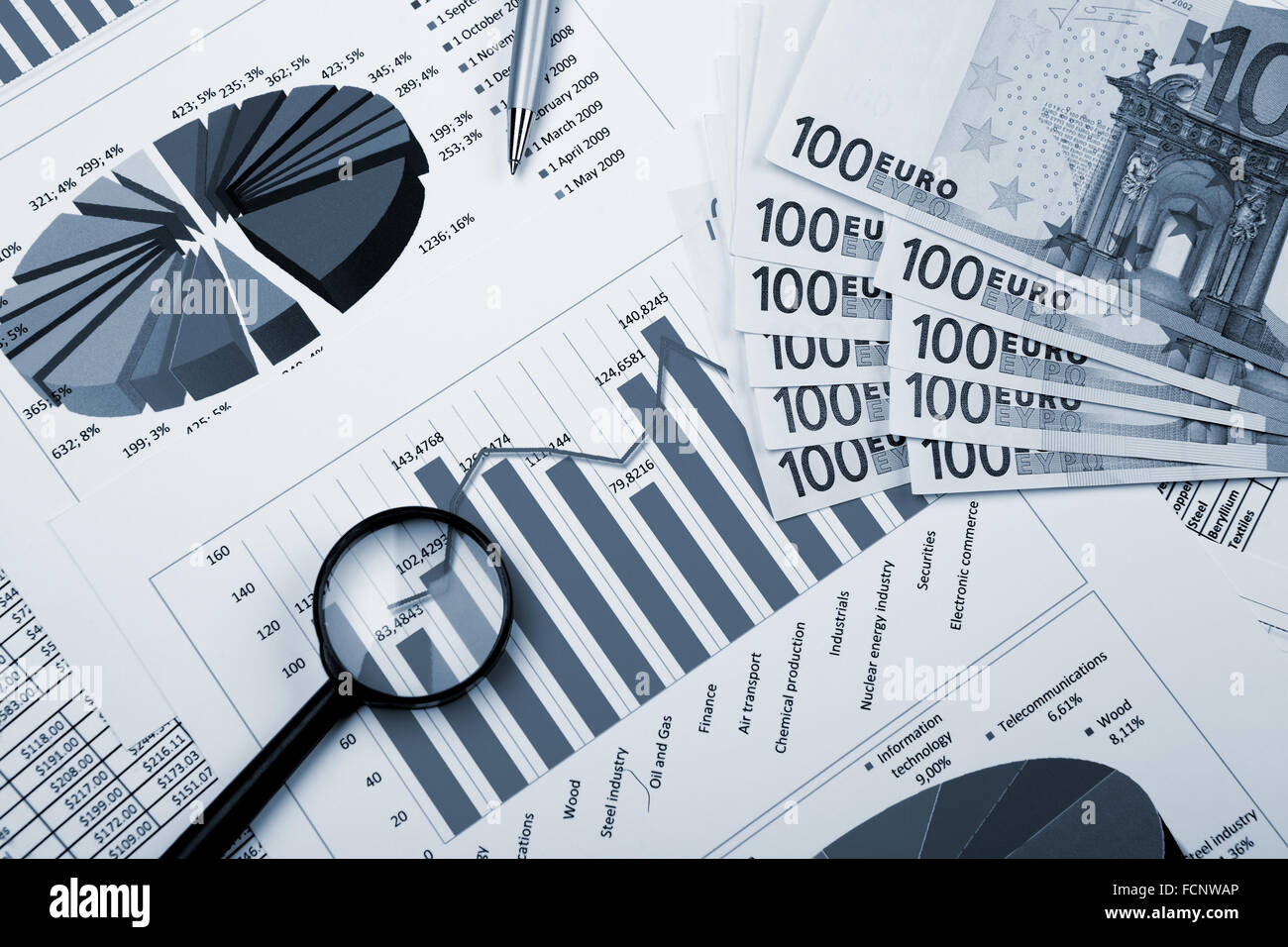 financial charts and graphs on the table Stock Photo - Alamy