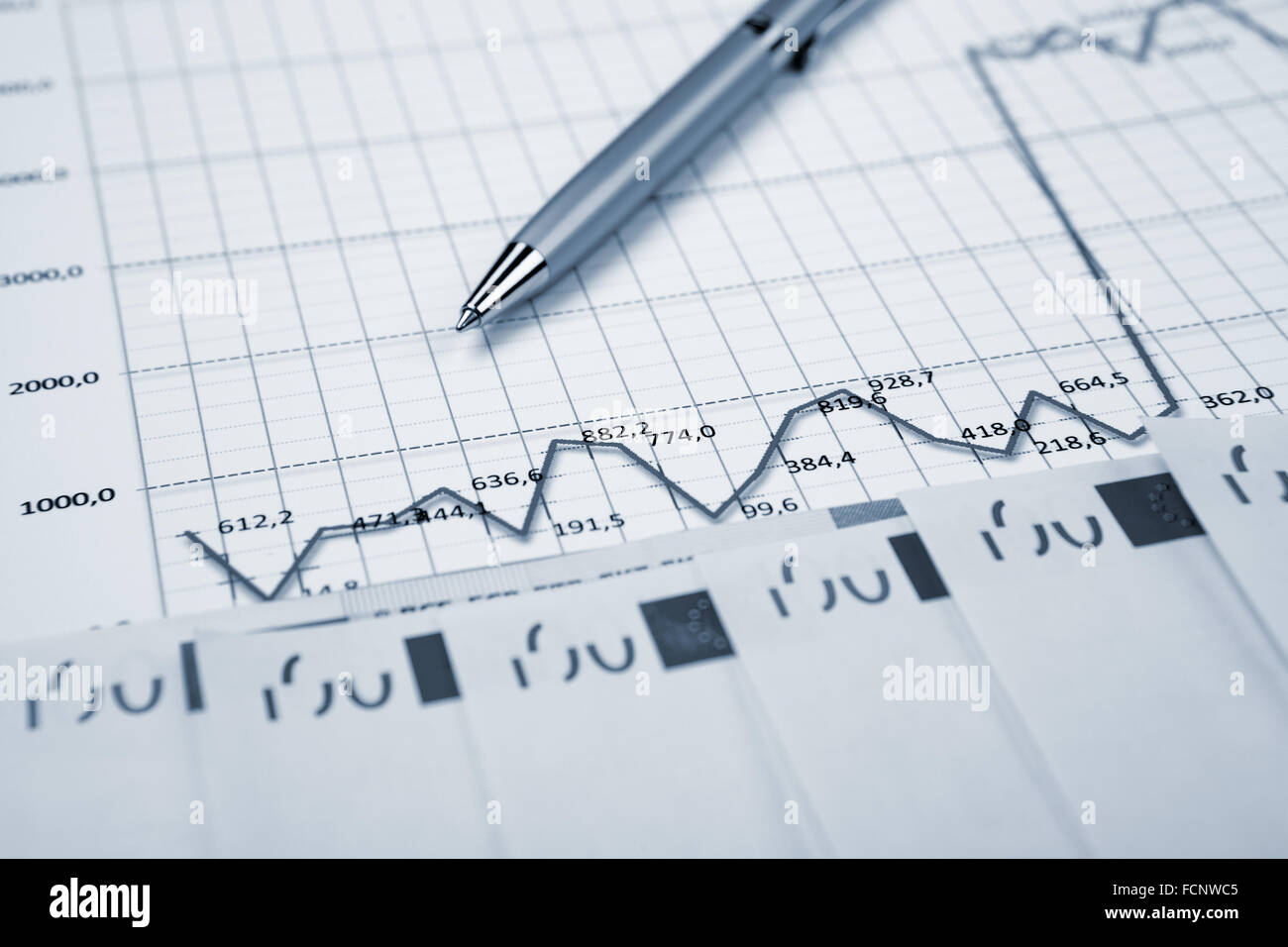 financial charts and graphs on the table Stock Photo - Alamy