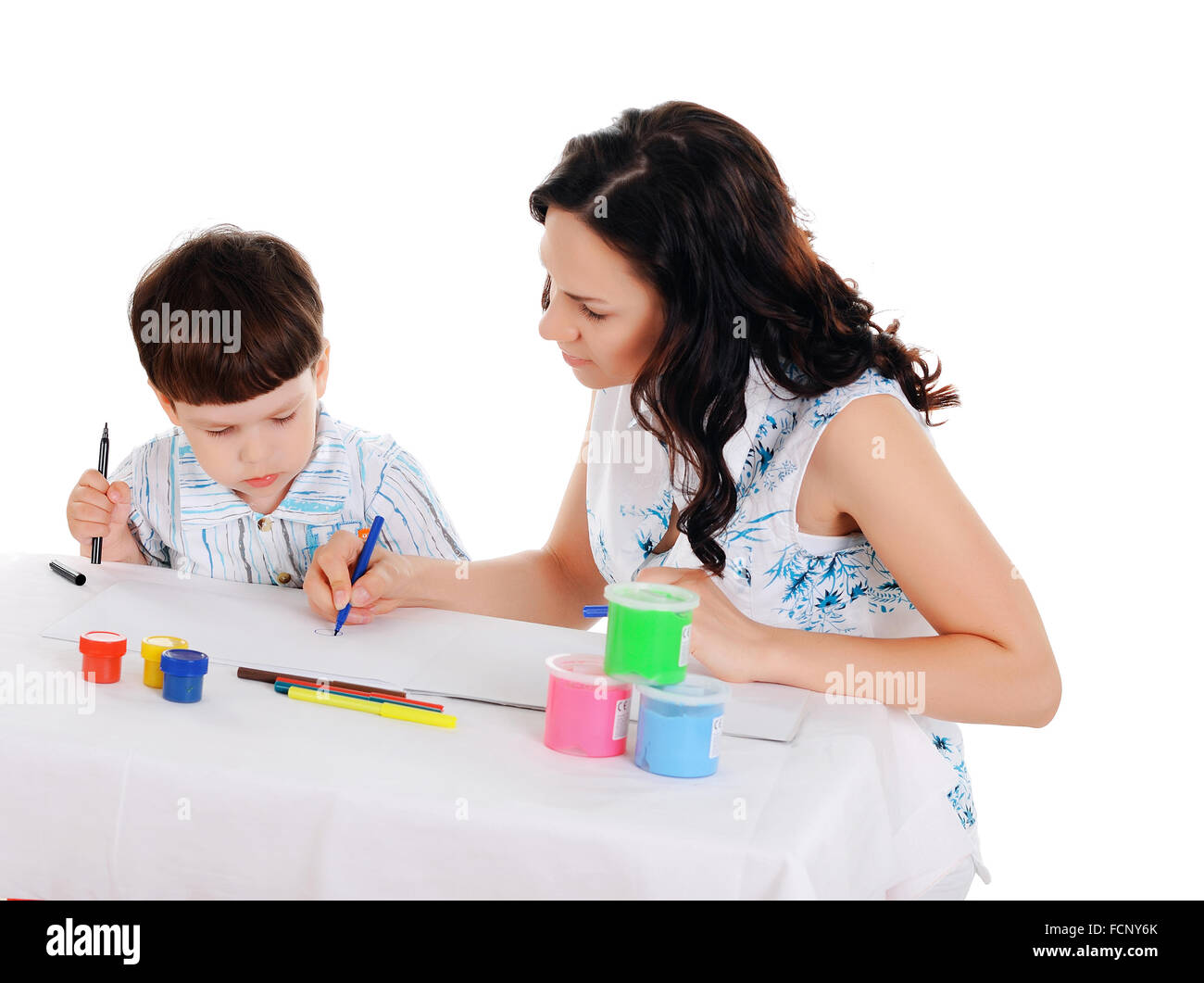 young mother and her little son paint colors in this album Stock Photo ...