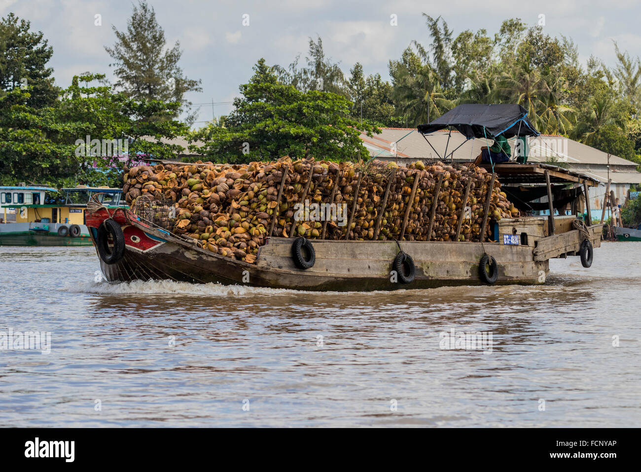 Boats carry goods on the Mekong Delta for local and national use the ...