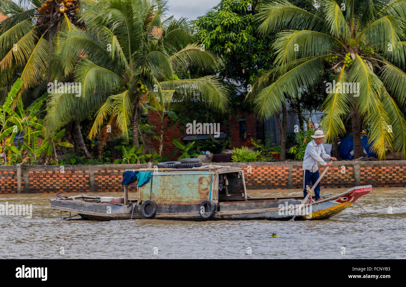 Boats carry goods on the Mekong Delta for local and national use the ...