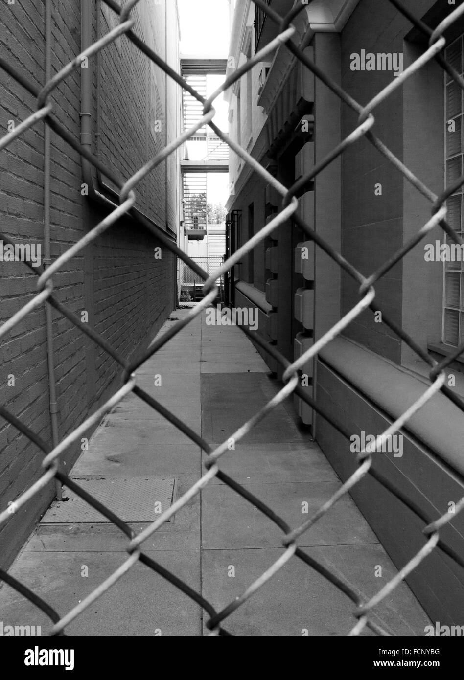 Alley behind fence hi-res stock photography and images - Alamy