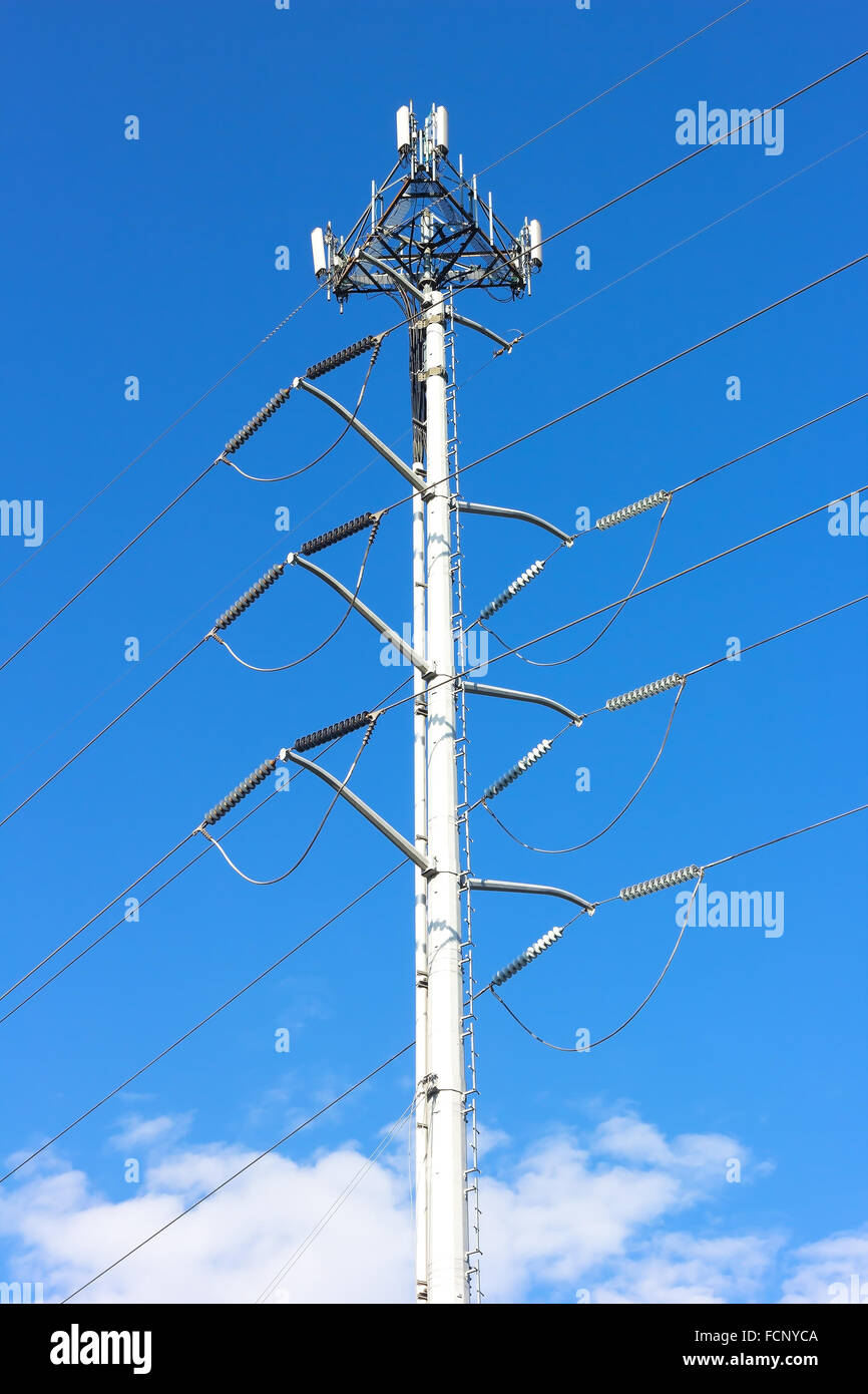 Power grid and telecommunication antennas on one pylon Stock Photo - Alamy