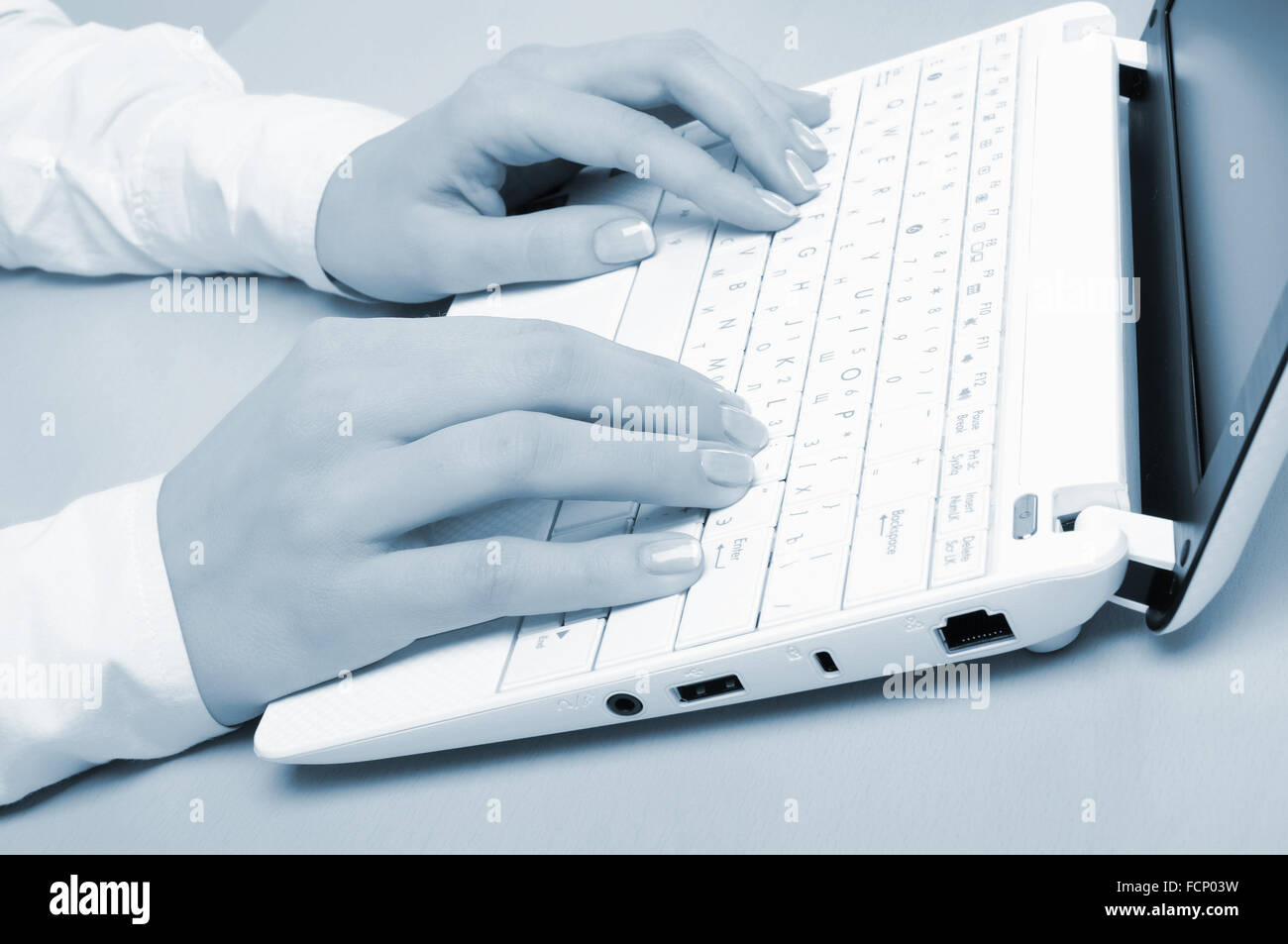 Hands of a young girl running on a computer in the office Stock Photo ...
