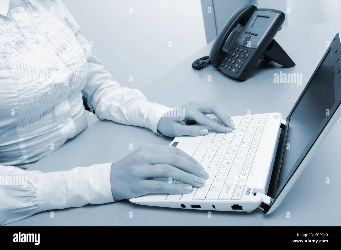 Hands of a young girl running on a computer in the office Stock Photo ...