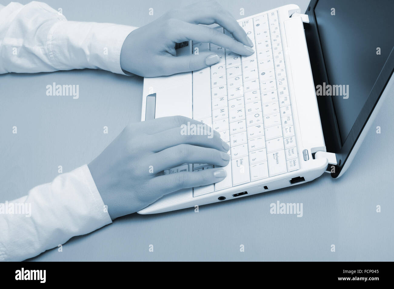 Hands of a young girl running on a computer in the office Stock Photo ...
