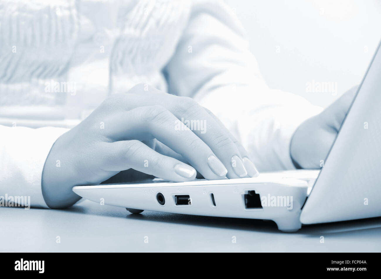 Hands of a young girl running on a computer in the office Stock Photo ...
