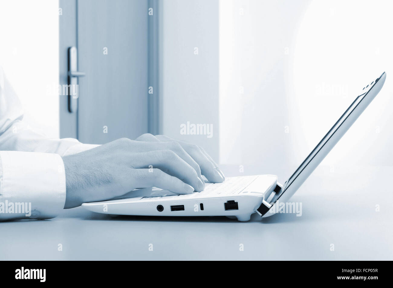 Hands of a young girl running on a computer in the office Stock Photo ...
