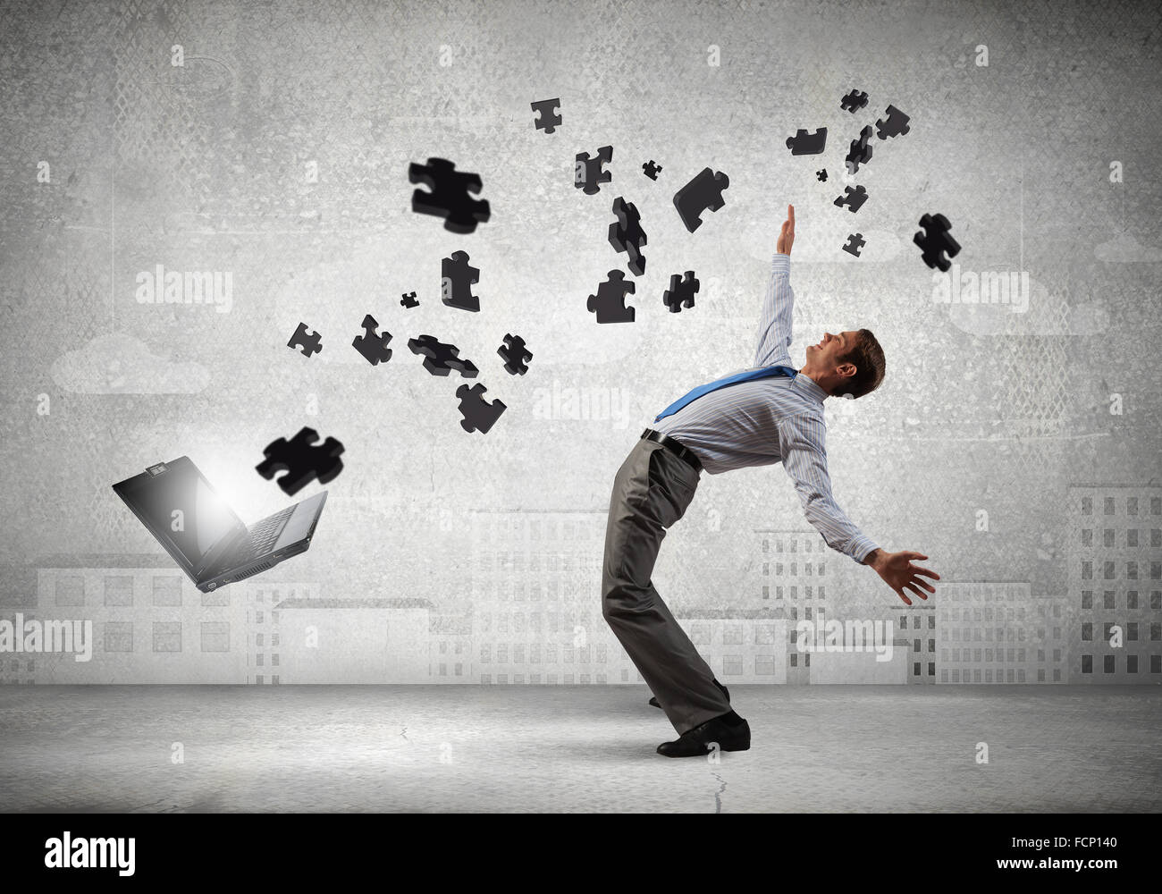 Young businessman evading icon flying from laptop Stock Photo - Alamy