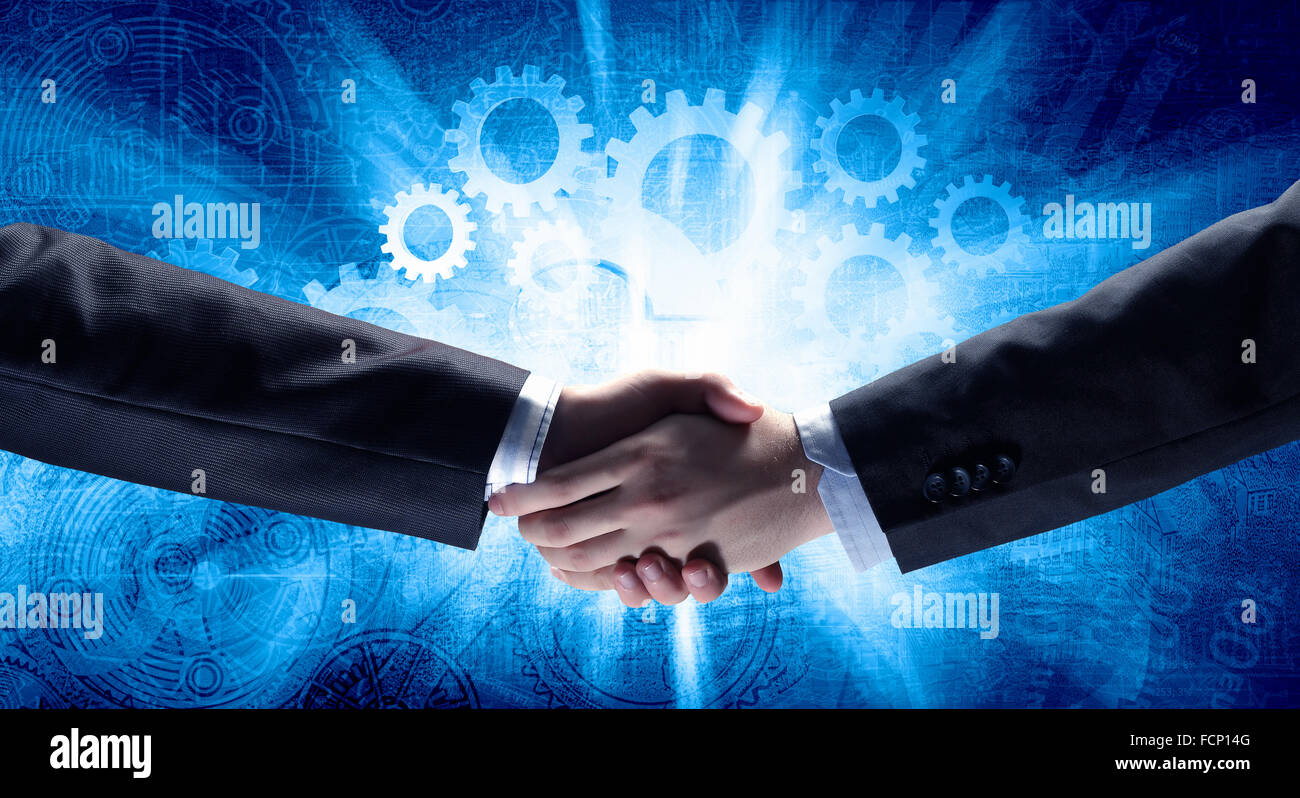 Close up of business handshake on digital background Stock Photo - Alamy