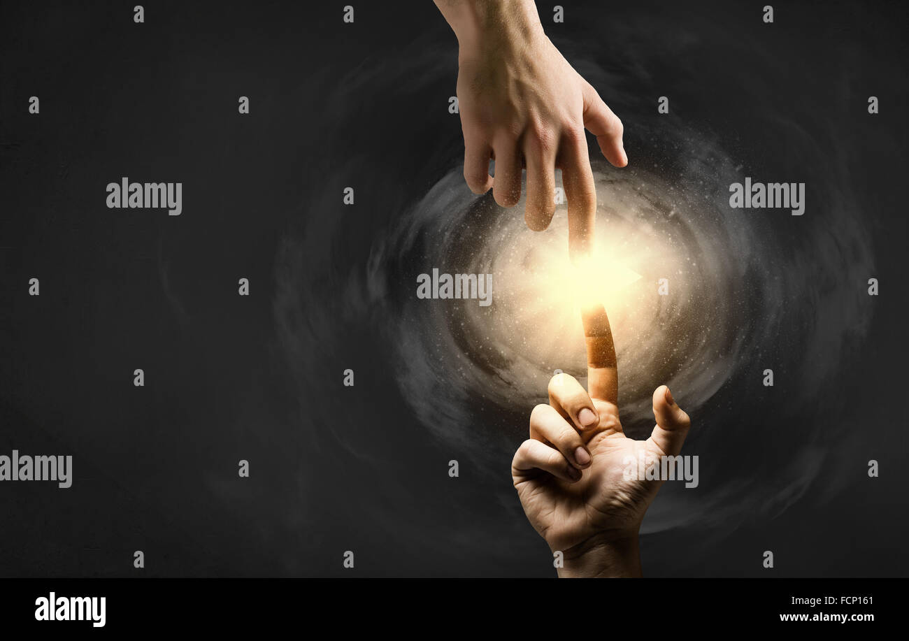 Close up of two hands reaching each other with fingers Stock Photo - Alamy