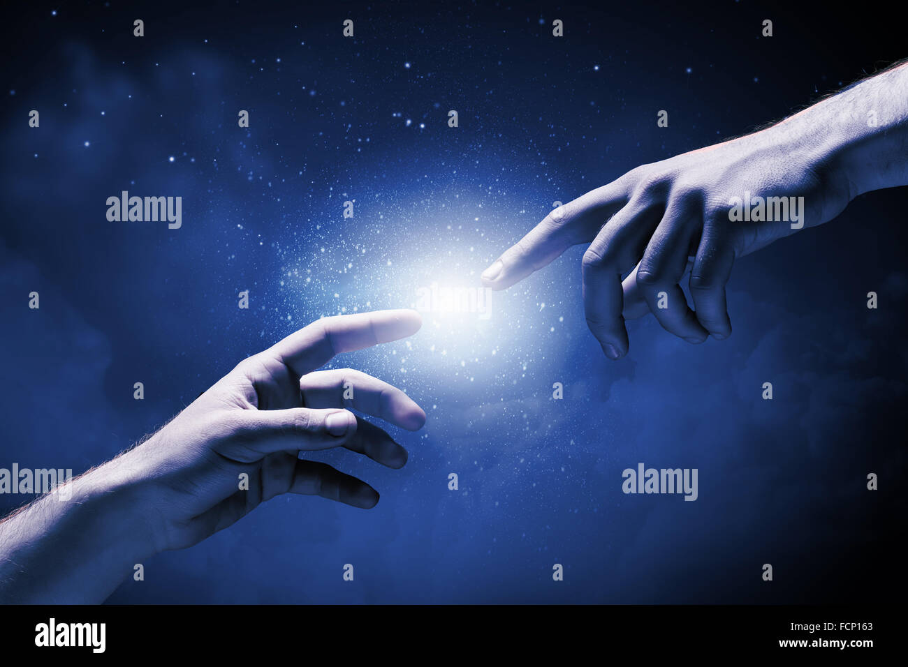 Close up of two hands reaching each other with fingers Stock Photo - Alamy