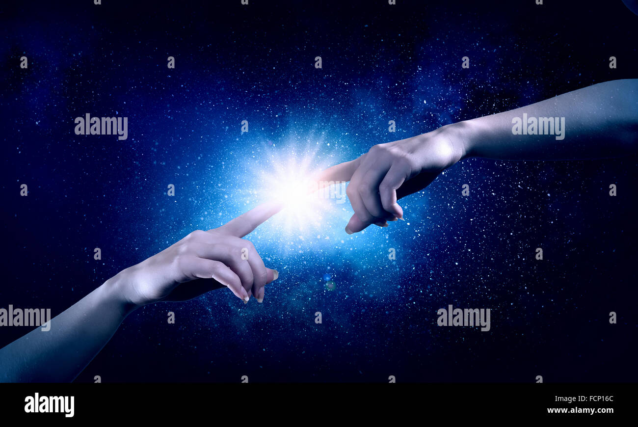 Close up of two hands reaching each other with fingers Stock Photo - Alamy