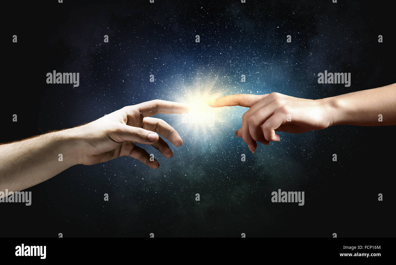 Close up of two hands reaching each other with fingers Stock Photo - Alamy