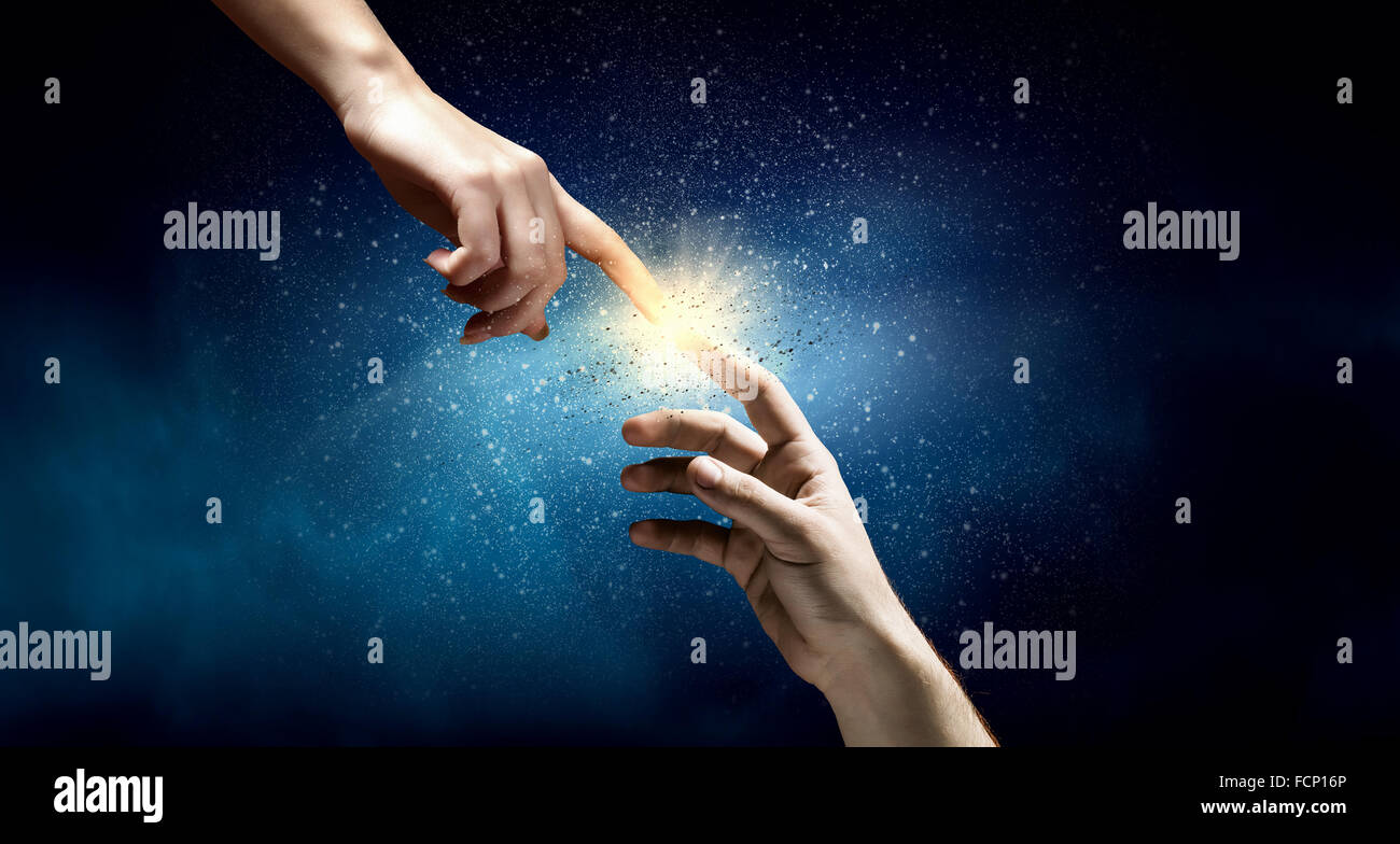 Close up of two hands reaching each other with fingers Stock Photo - Alamy