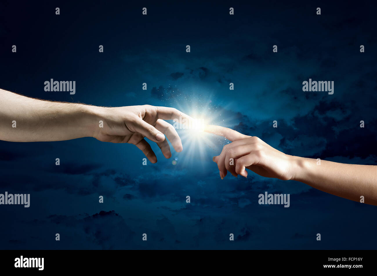 Close up of two hands reaching each other with fingers Stock Photo - Alamy