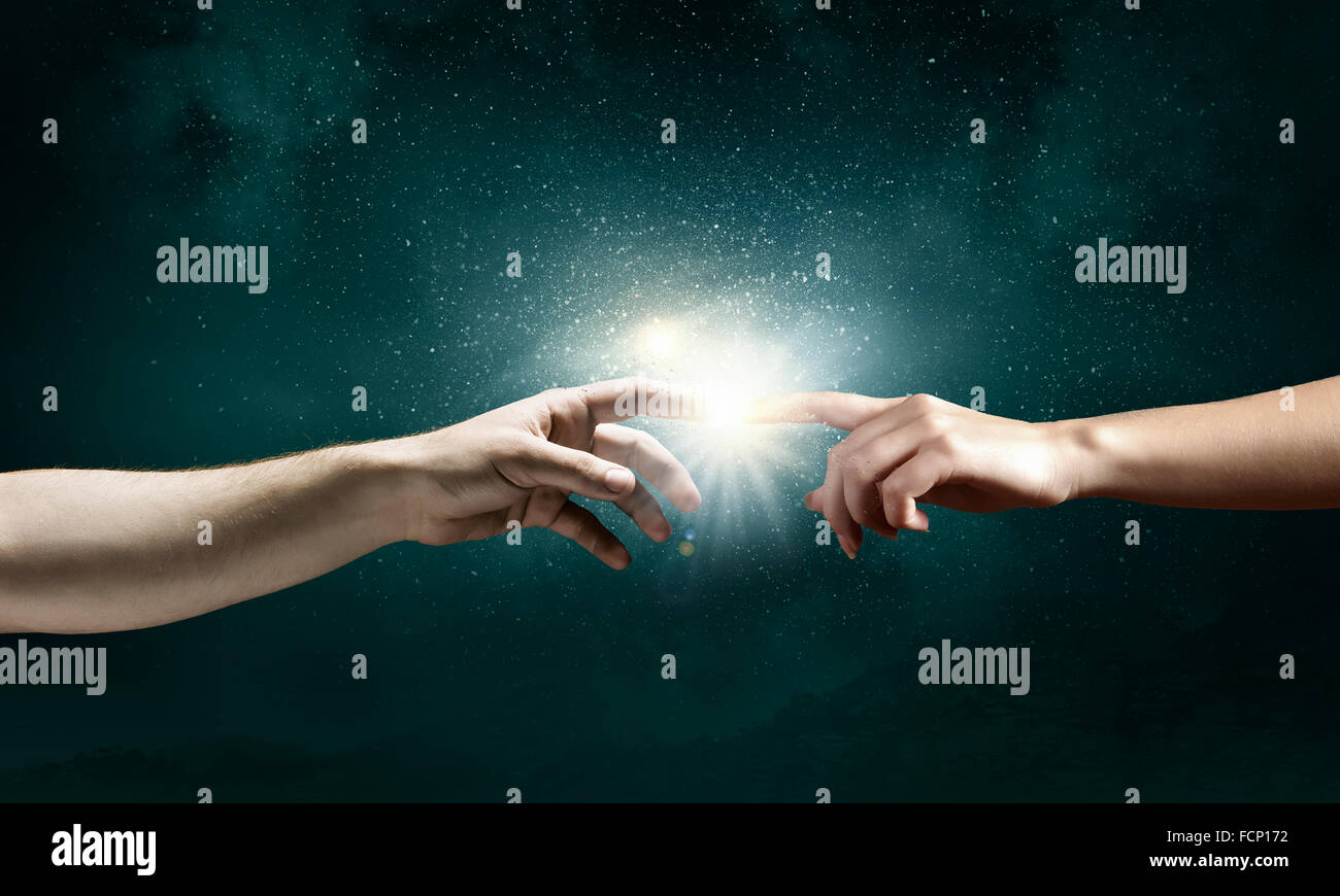 Close up of two hands reaching each other with fingers Stock Photo - Alamy