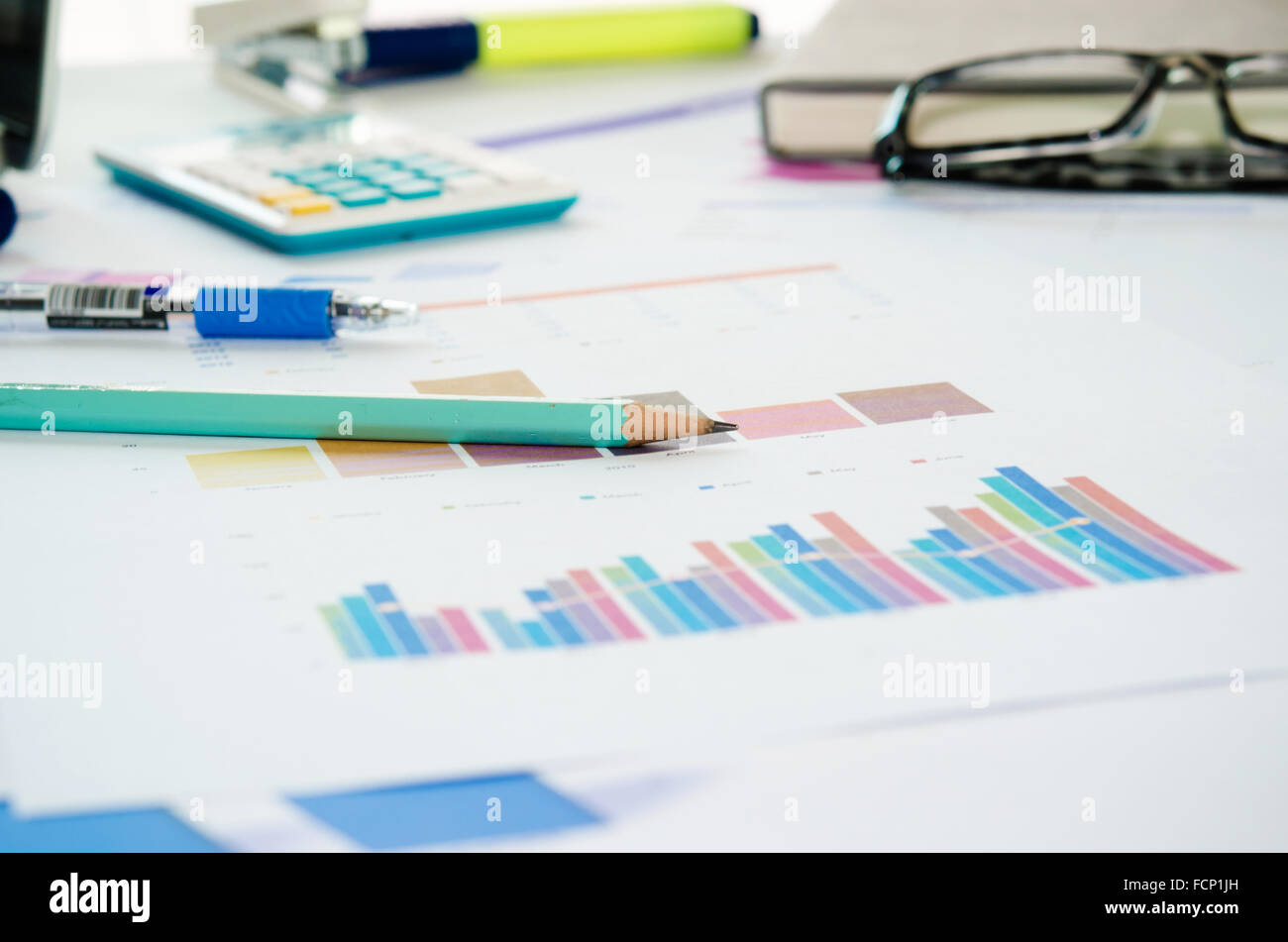 Financial paper charts and graphs on the table Stock Photo - Alamy