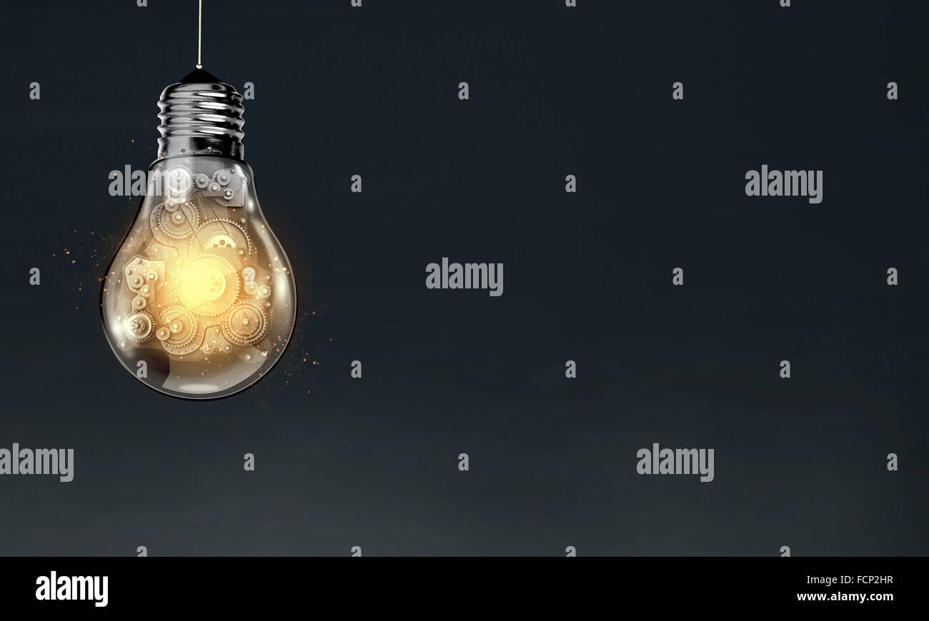 Concept of mechanism light bulb with gears inside Stock Photo - Alamy
