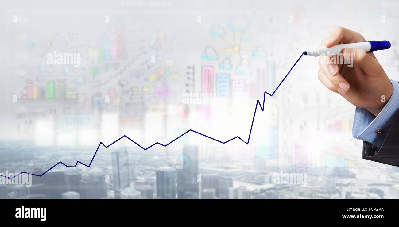 Close up of businessman drawing increasing graph with marker Stock ...