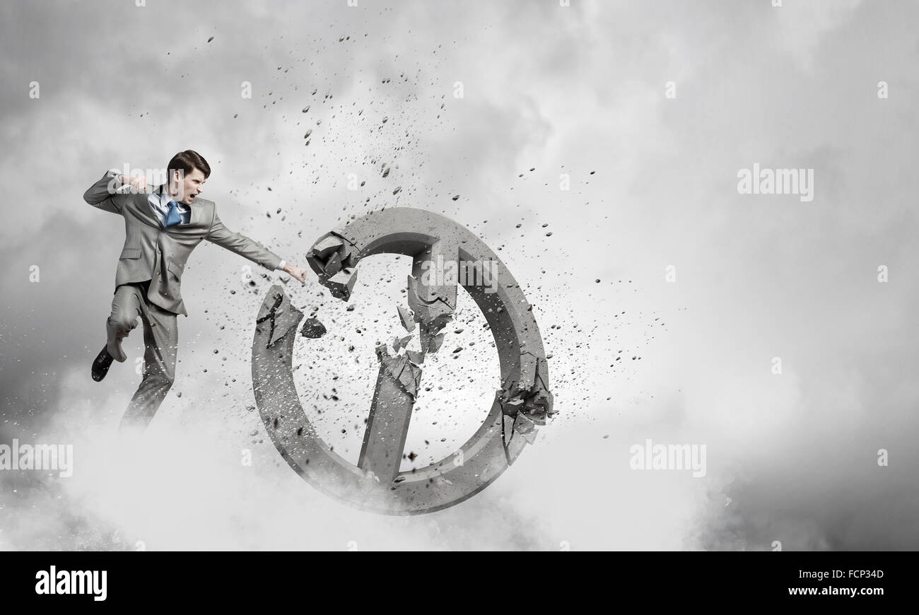 Angry determined businessman crashing stone prohibition symbol Stock ...