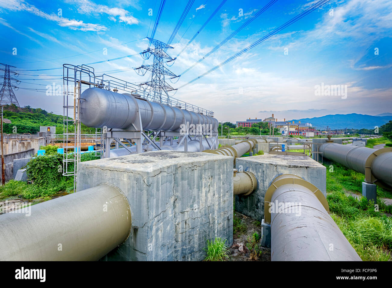 Oil refinery and power tower Stock Photo - Alamy