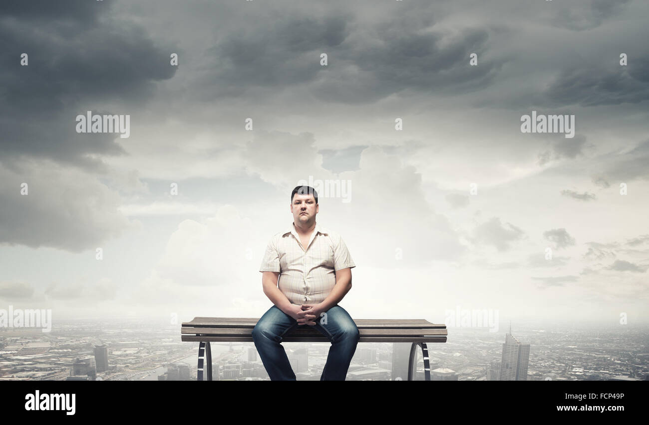Fat man sitting on bench hi-res stock photography and images - Alamy